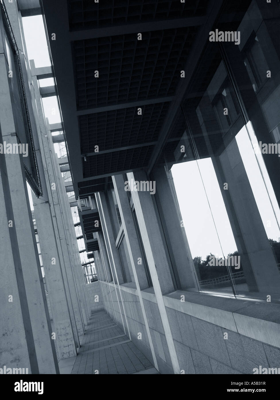 Exterior of building corridor with windows and pillars Stock Photo - Alamy