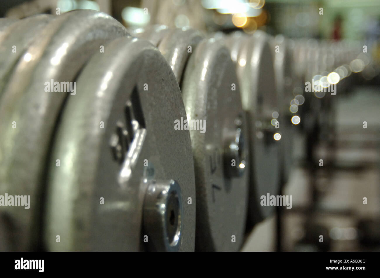 Line of free weights Stock Photo - Alamy