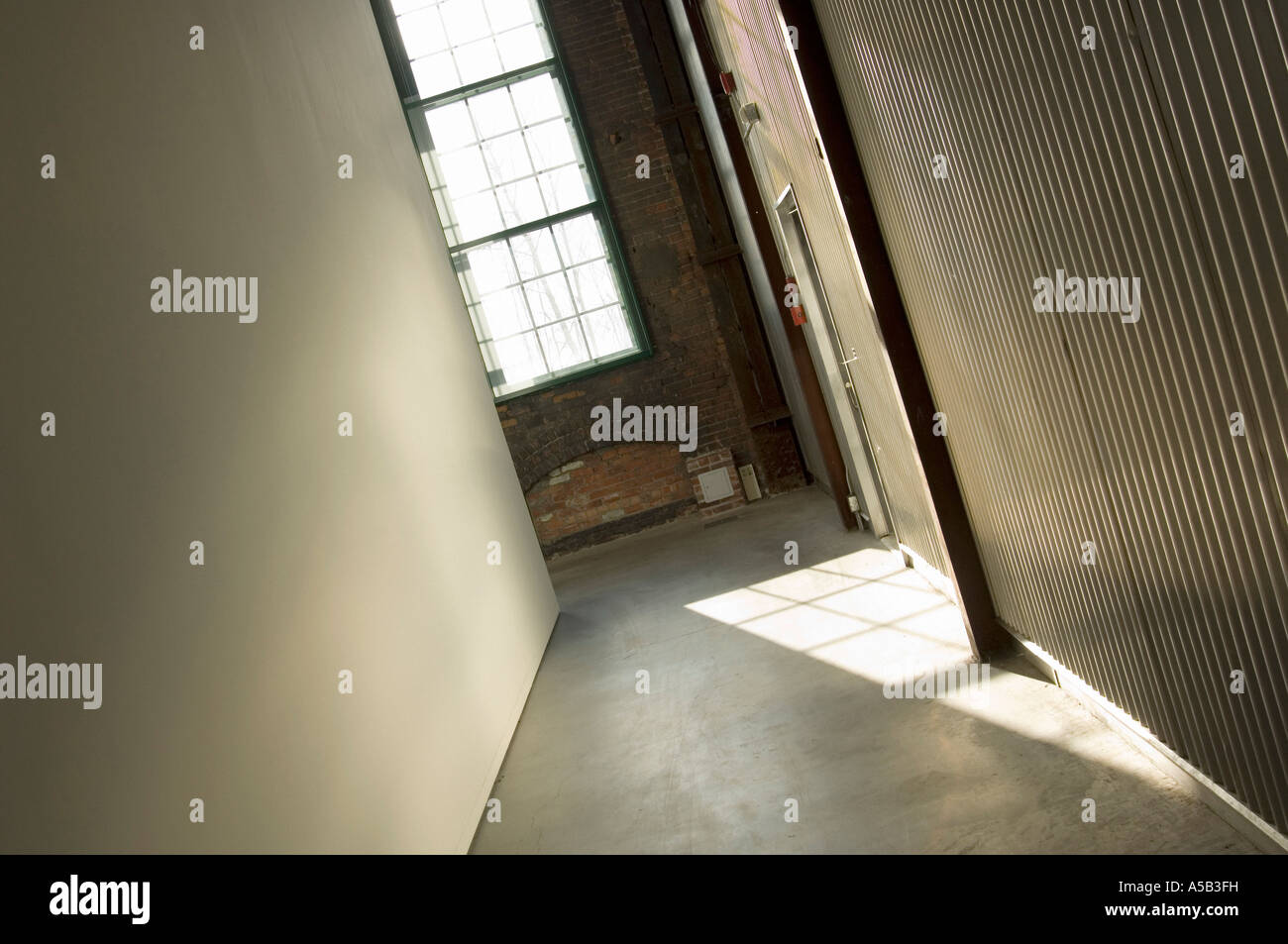 Angled view of an industrial hallway Stock Photo - Alamy