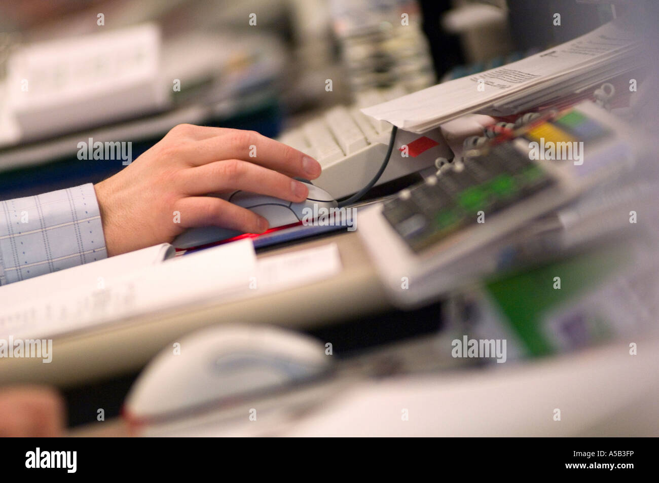 Office worker using computer mouse Stock Photo - Alamy