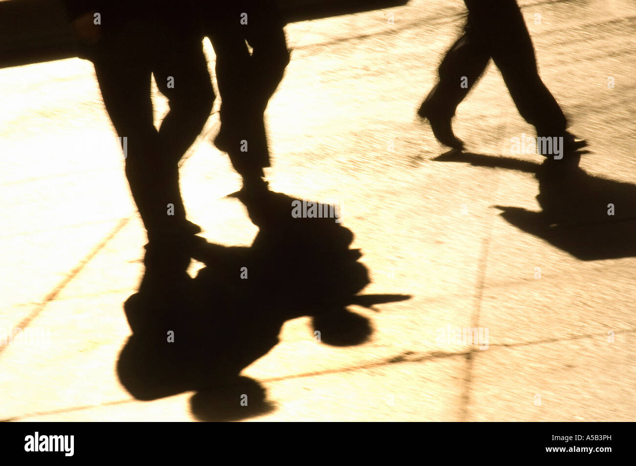 Shadows of people walking Stock Photo - Alamy