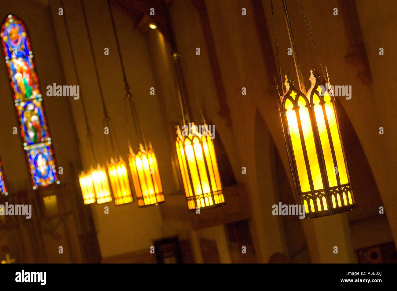 Suspended lights inside church Stock Photo - Alamy