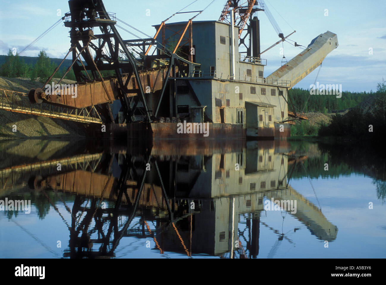 floating abandoned gold dredge reflecting in pond Chatanika Gold fields ...