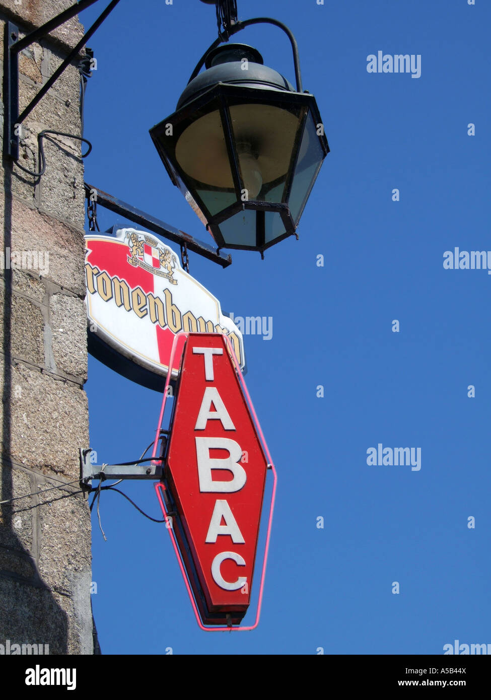 A tabac sign in France against a blue sky Stock Photo - Alamy