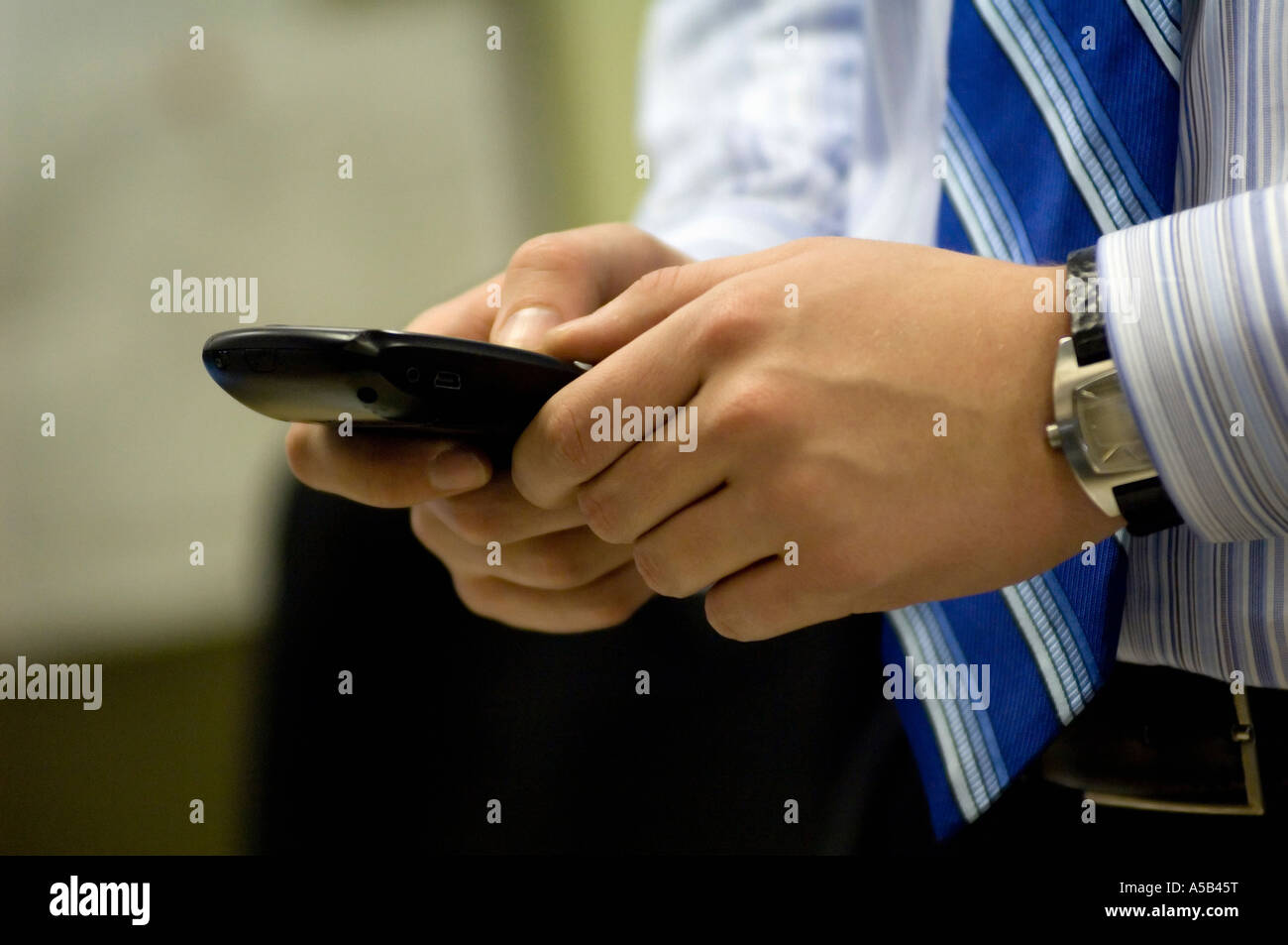 Business man using PDA in office Stock Photo - Alamy
