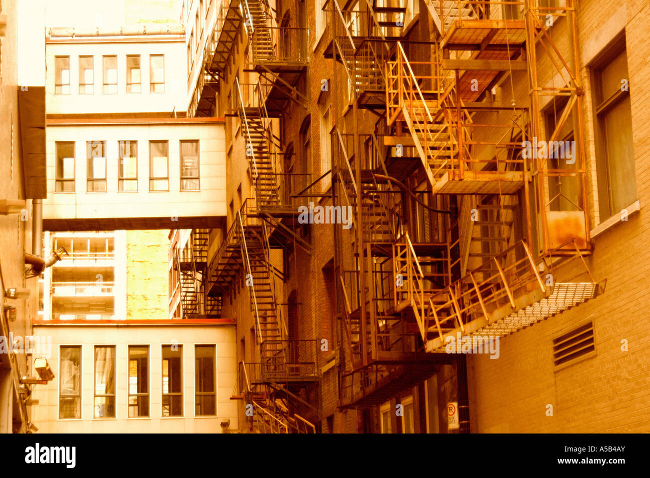 Back alley fire escapes Stock Photo - Alamy