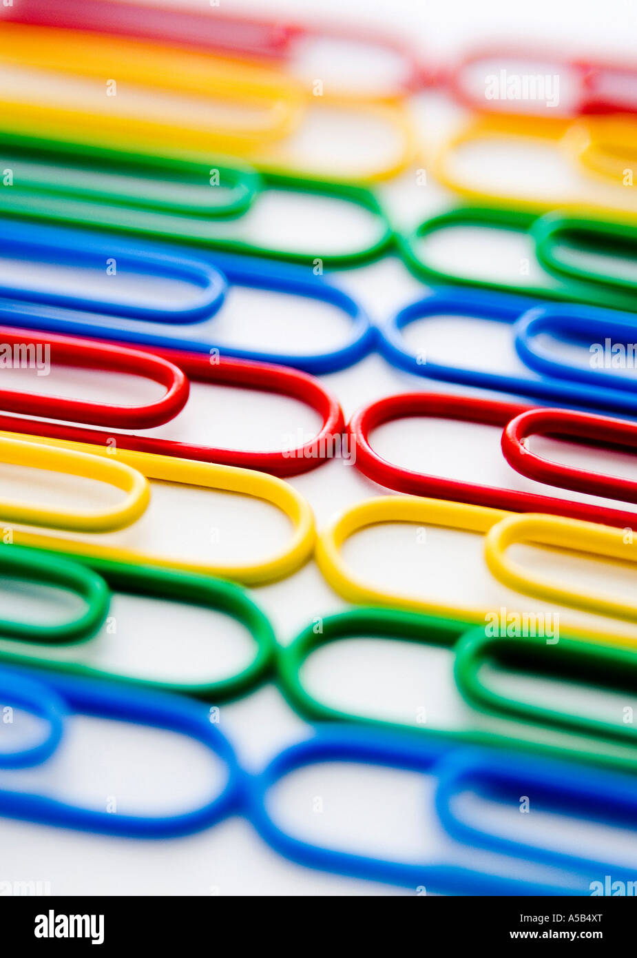 Collection of colourful paper clips lined up Stock Photo - Alamy