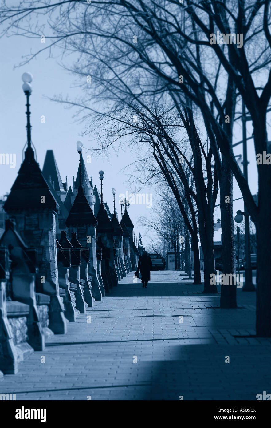 Lonely stroll down sidewalk Stock Photo - Alamy