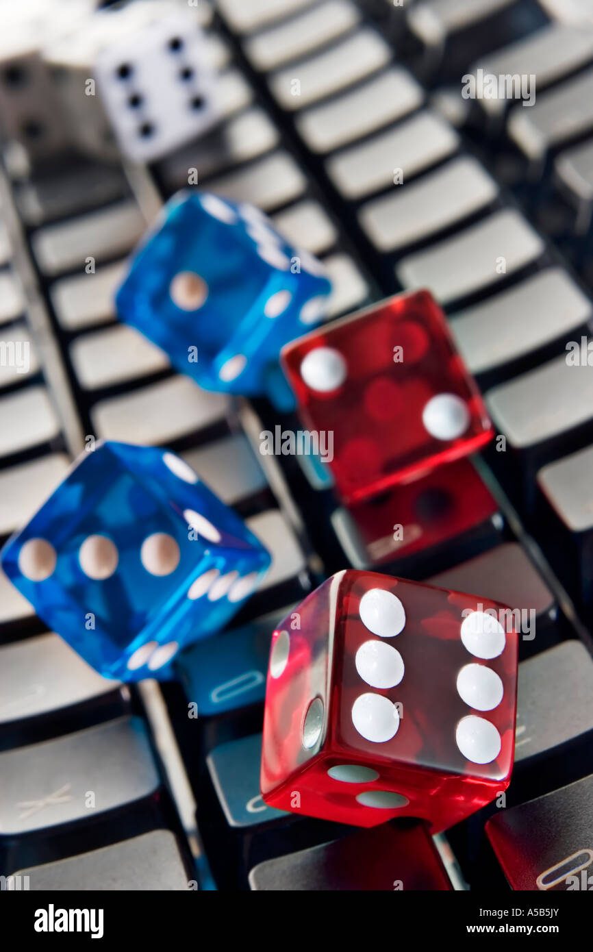 Dice on a computer keyboard Stock Photo - Alamy