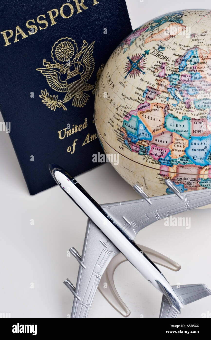 Passport, earth globe, and model plane Stock Photo - Alamy