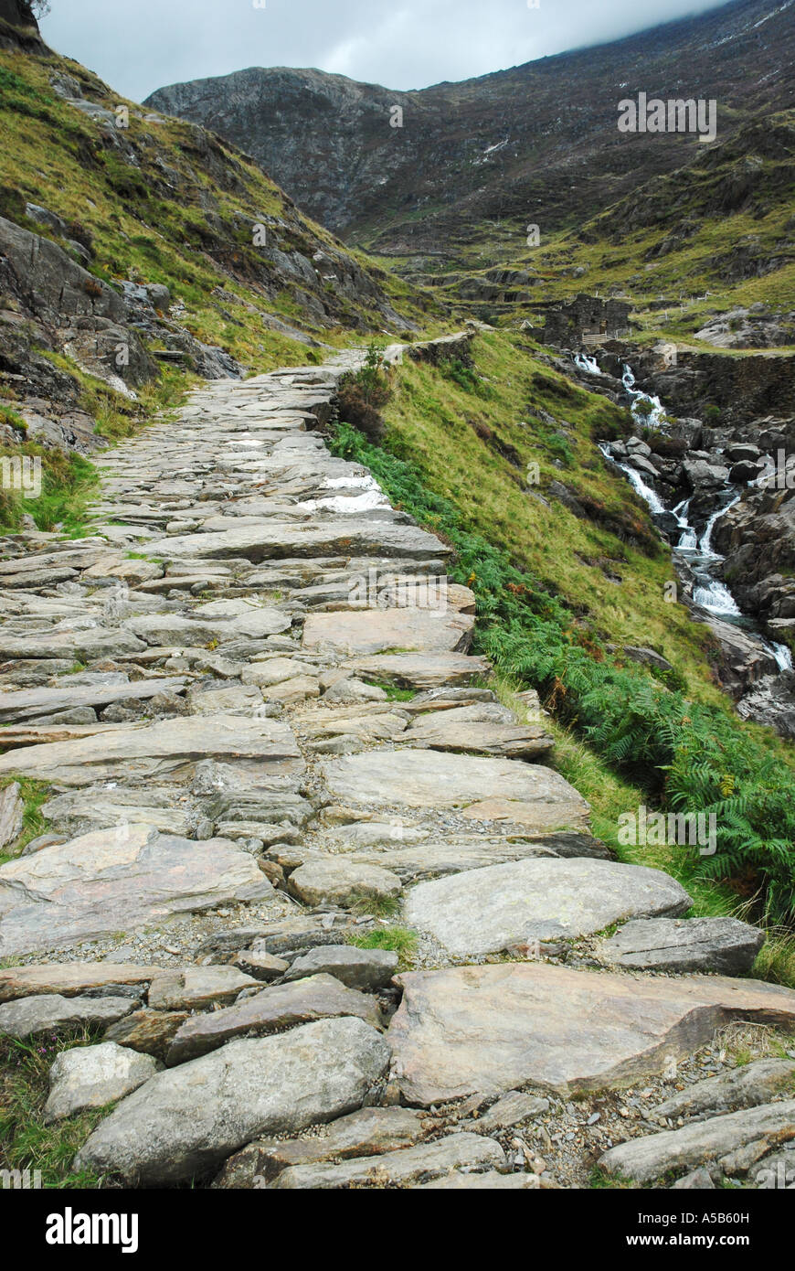 Ancient paved path through the foothills of Snowdon Stock Photo - Alamy