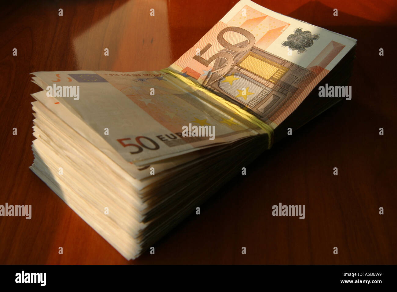 Stack of money Stock Photo - Alamy