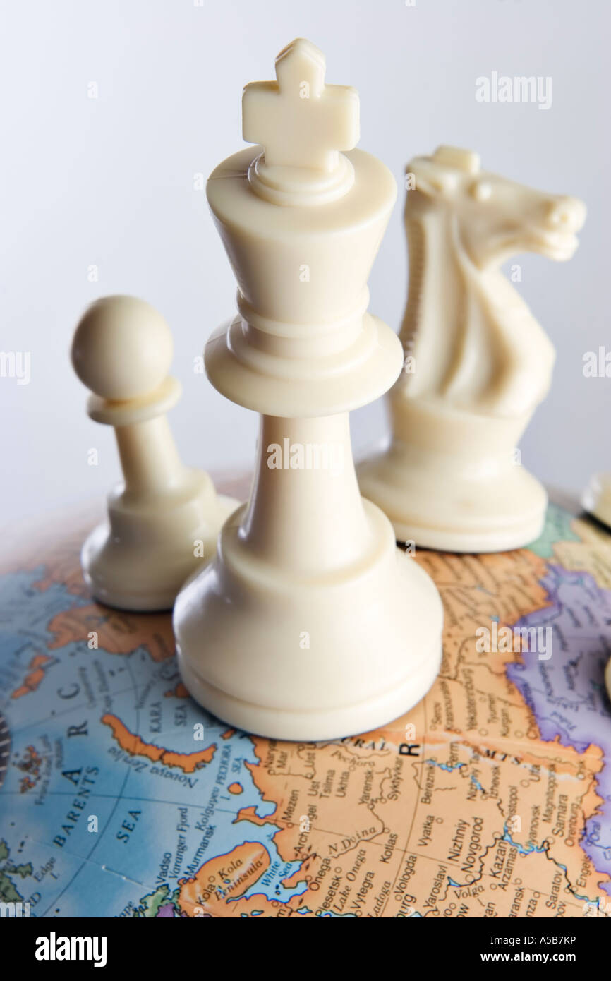 Chess pieces on globe hi-res stock photography and images - Alamy
