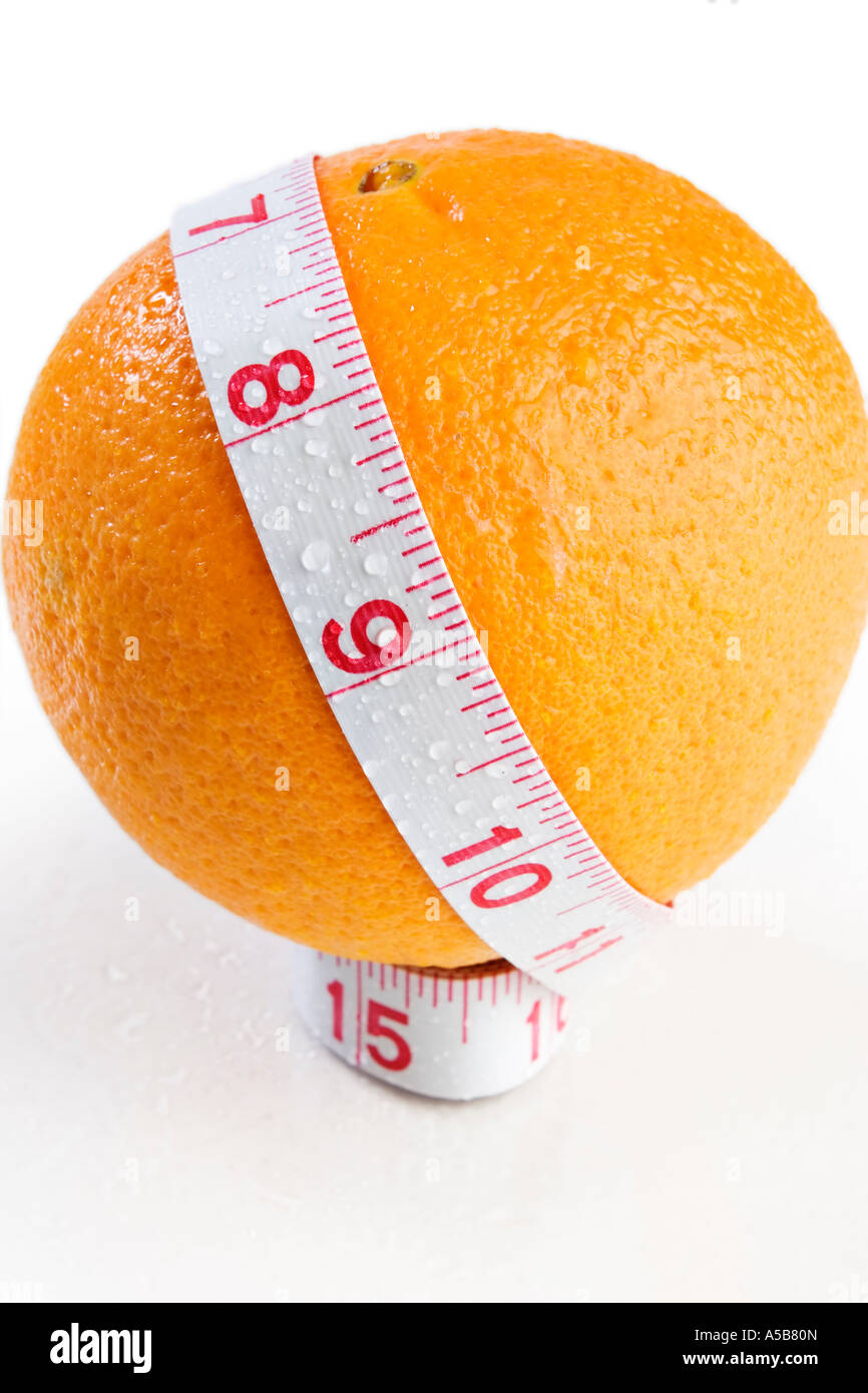 Orange and tape measure Stock Photo - Alamy