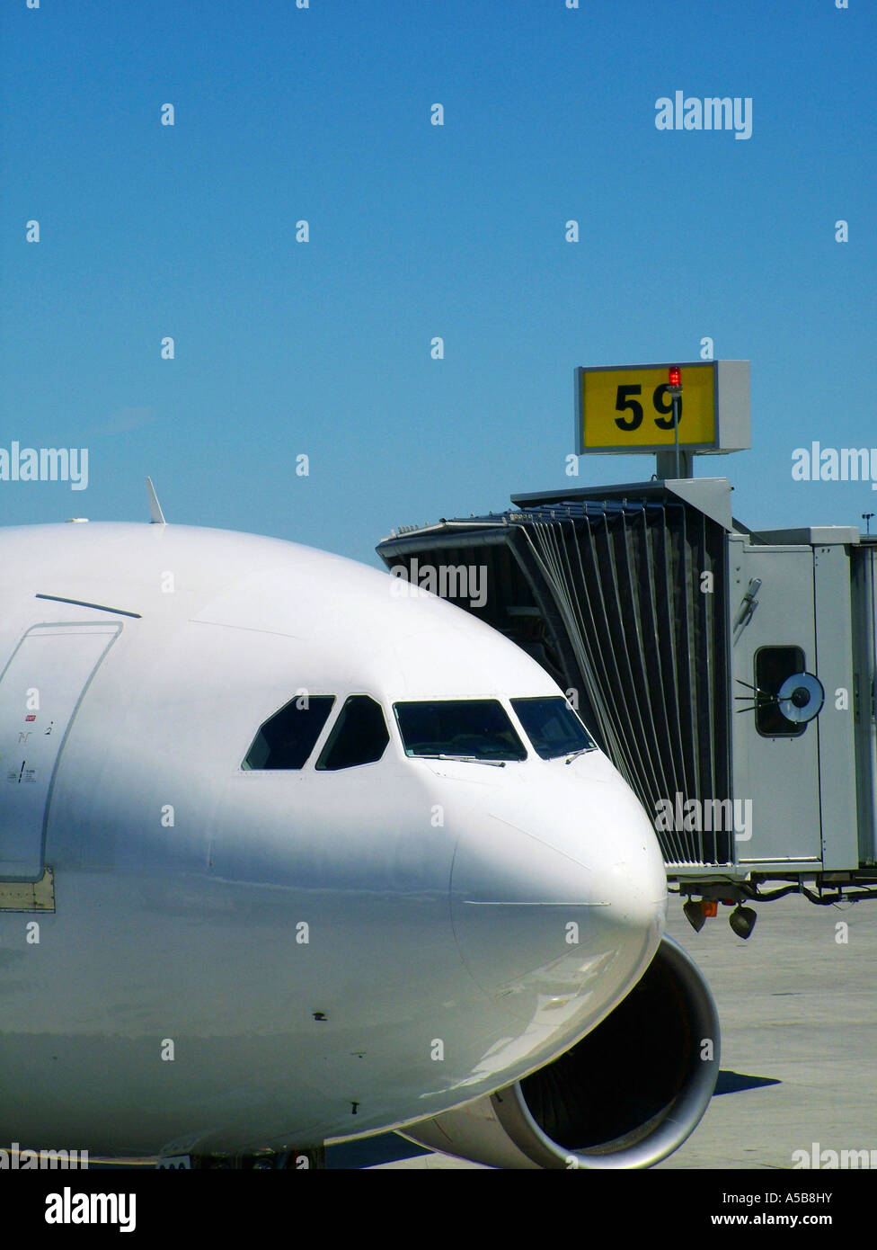 Airplane access bridge Stock Photo - Alamy