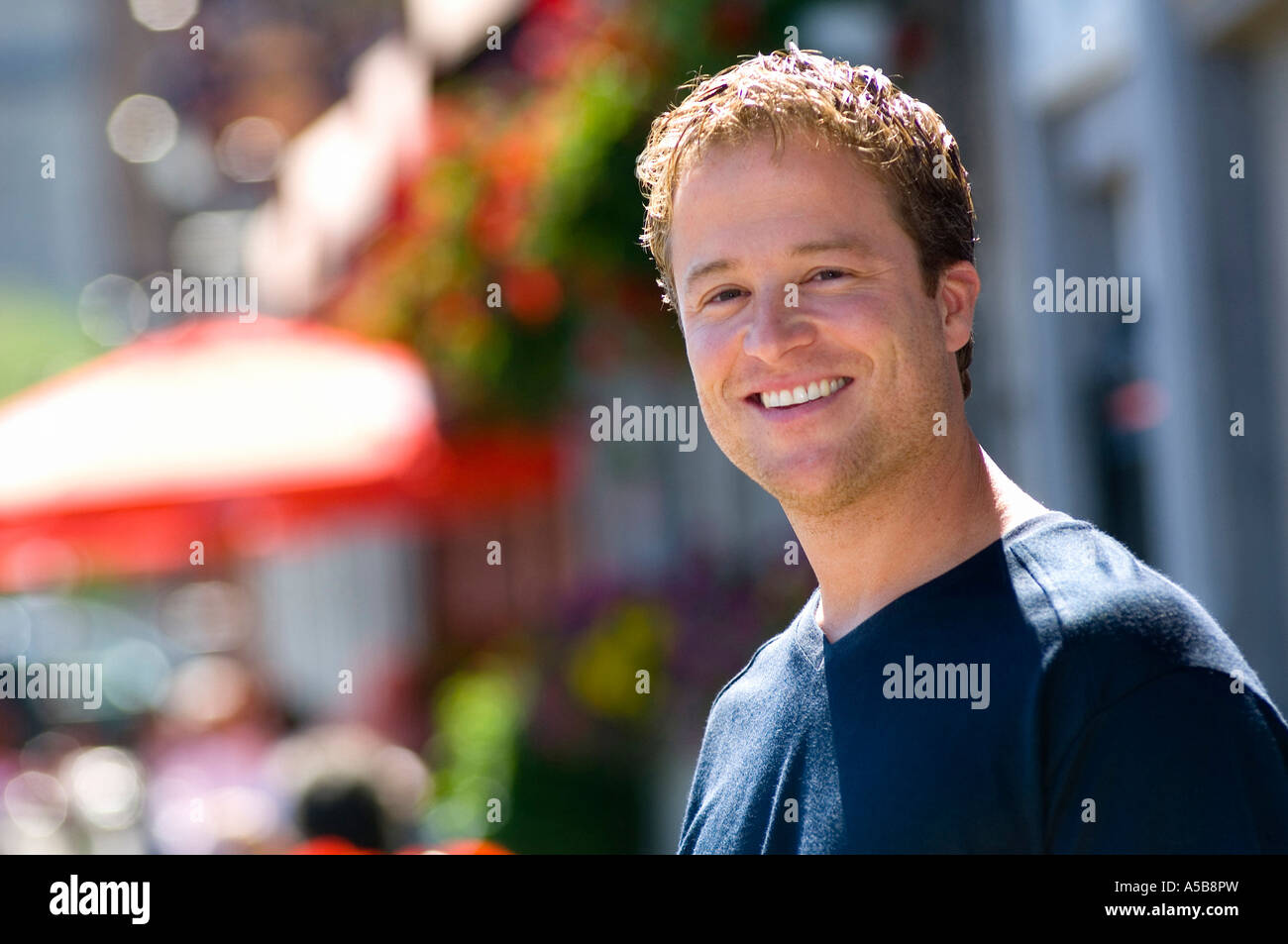 Portrait of man in front outdoor cafe Stock Photo - Alamy