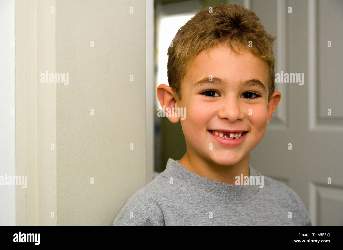 Proud young boy with newly lost tooth Stock Photo - Alamy