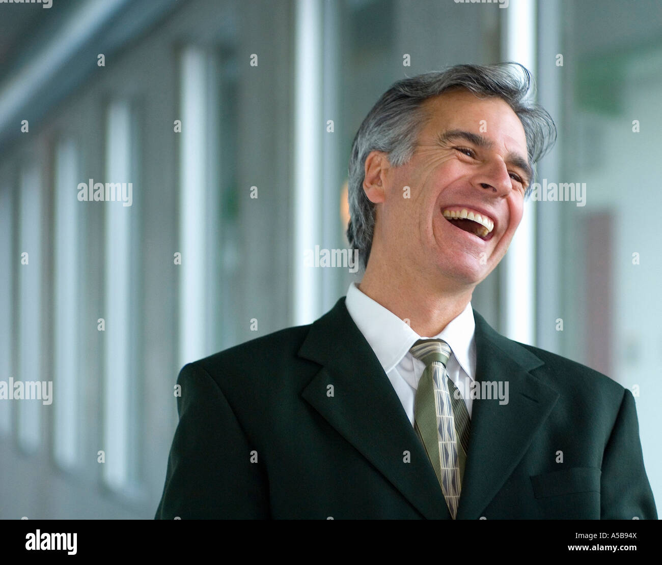 Businessman laughing out loud Stock Photo - Alamy