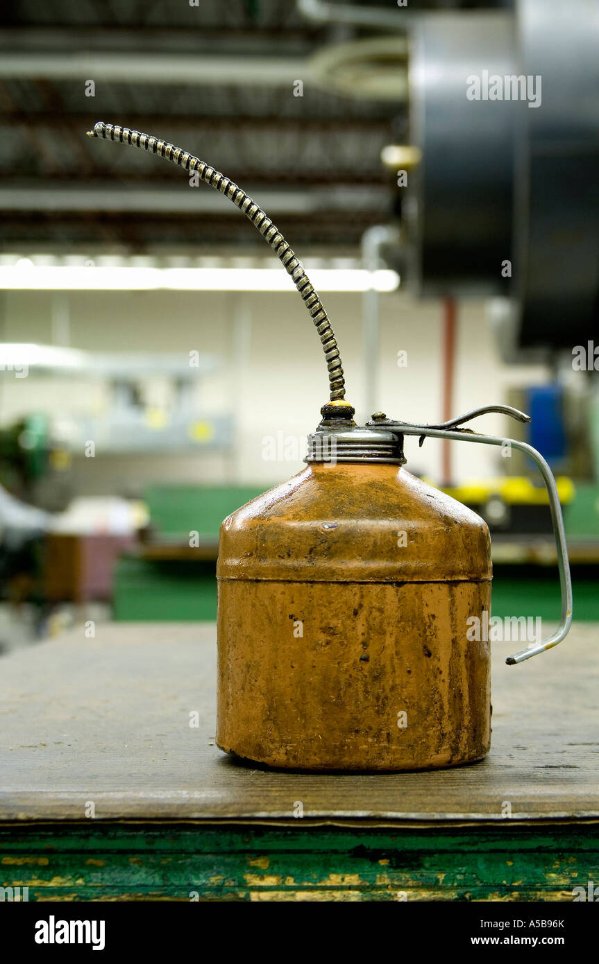 Well used oil can in factory Stock Photo - Alamy