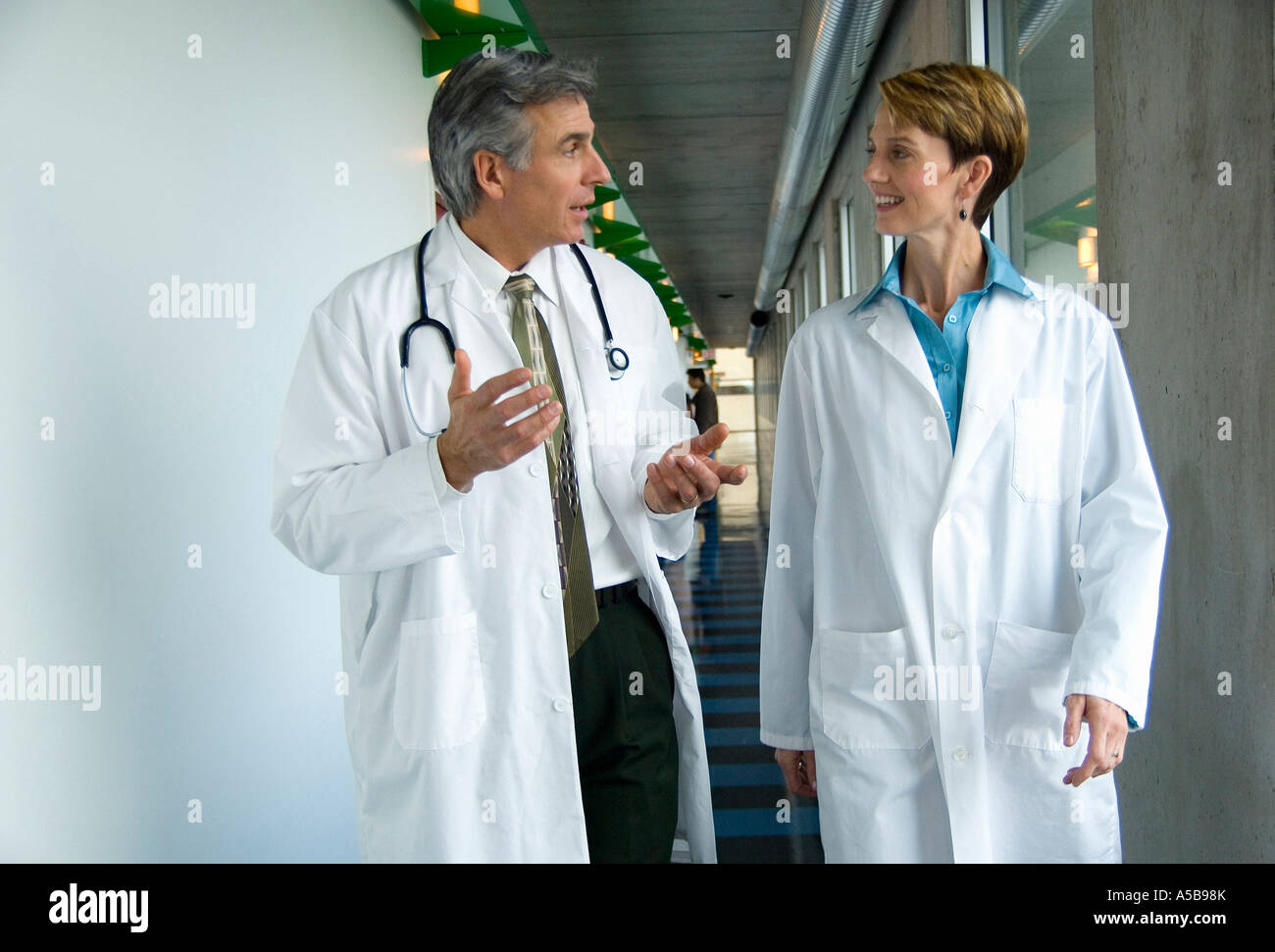 Man walking down hospital corridor hi-res stock photography and images ...