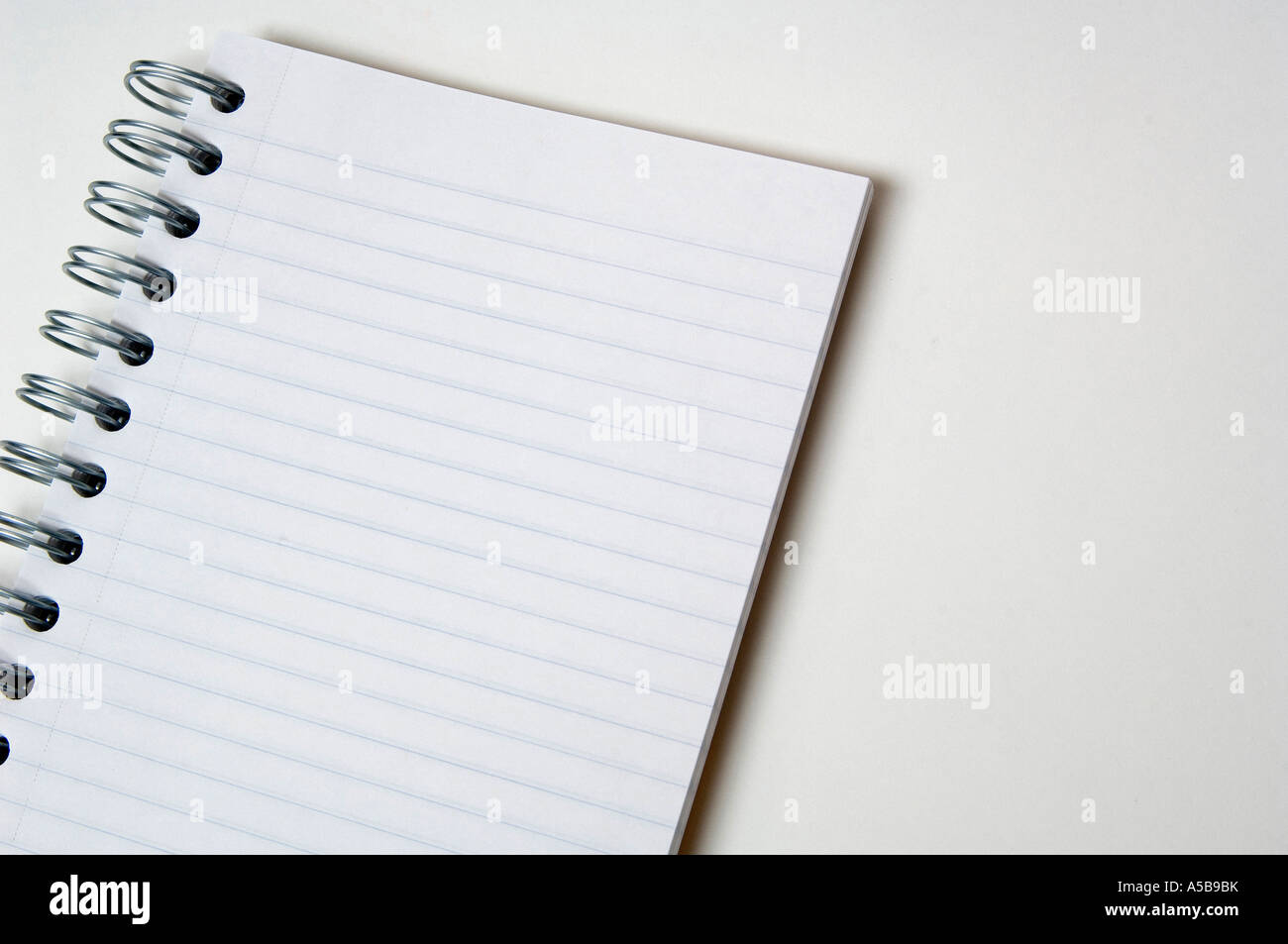 Blank coiled note pad on white Stock Photo - Alamy