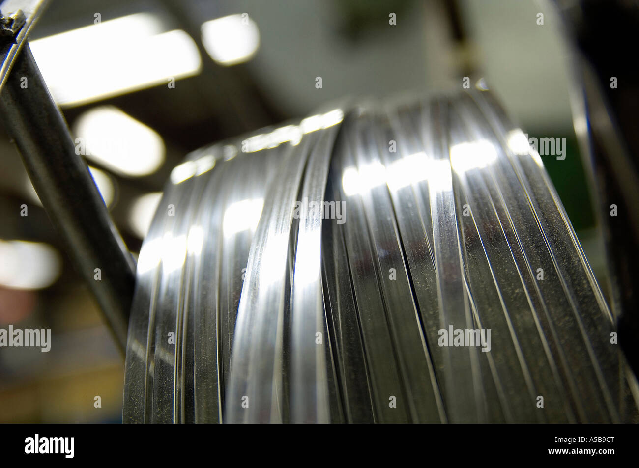 Long thin metal on spool Stock Photo - Alamy