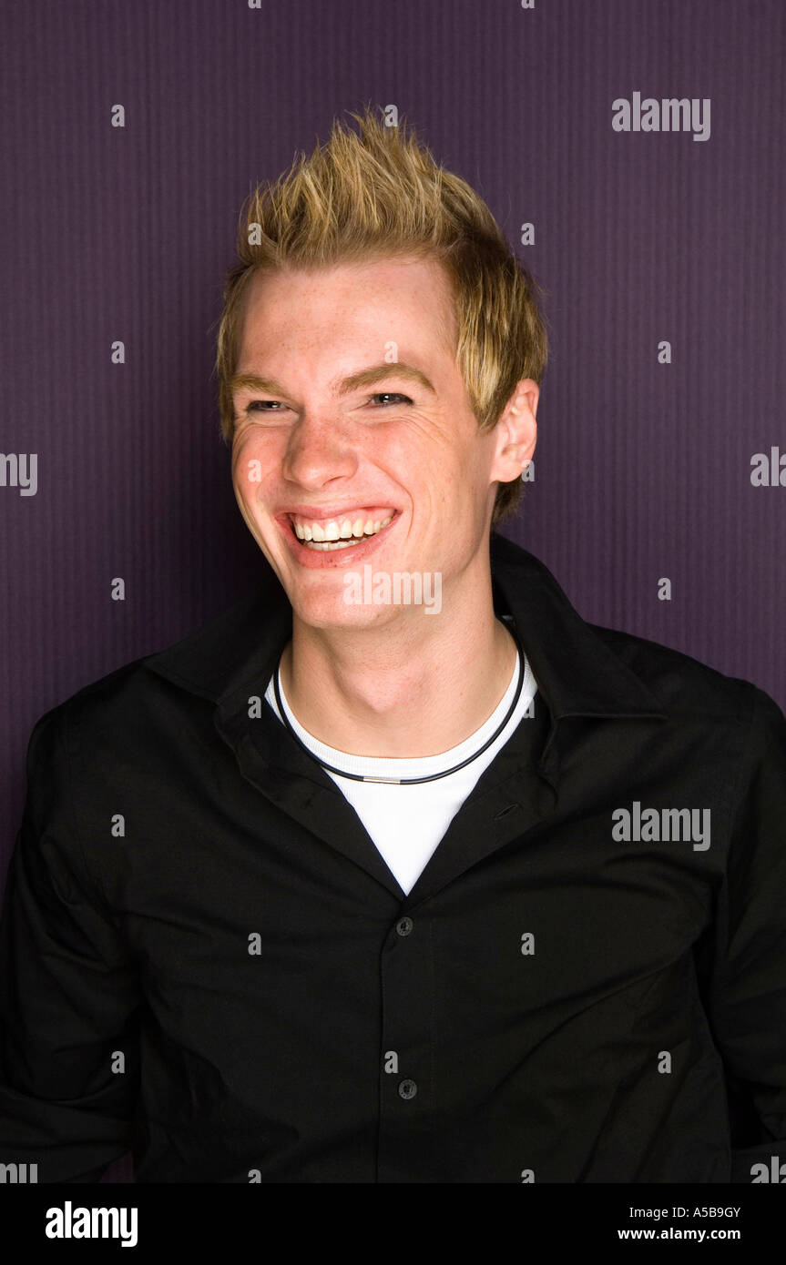 Young man posing in photo booth Stock Photo - Alamy