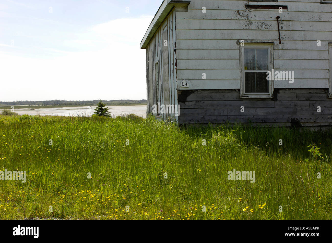 Abandoned building beside waterfront Stock Photo - Alamy