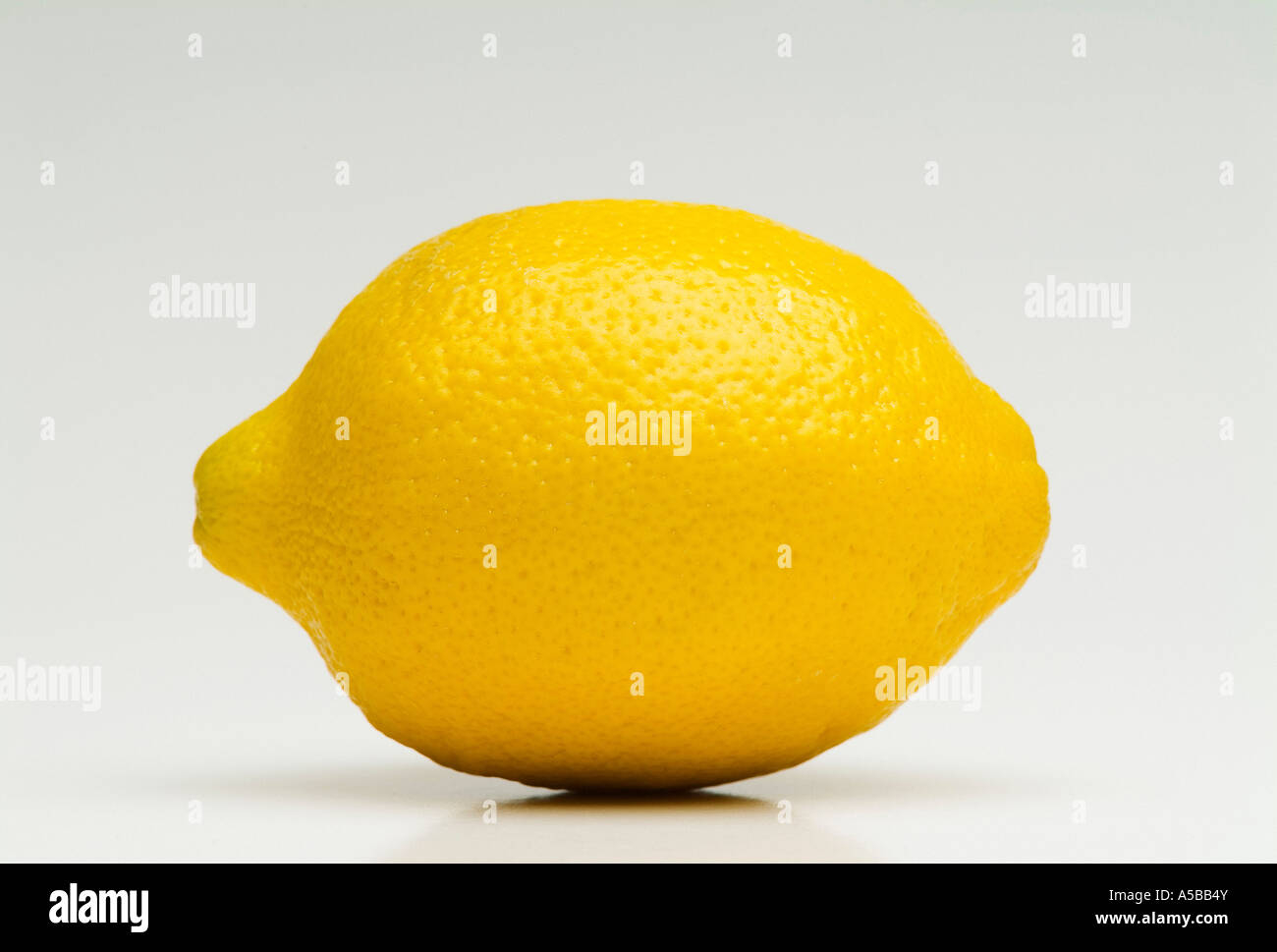 Single lemon on white Stock Photo - Alamy