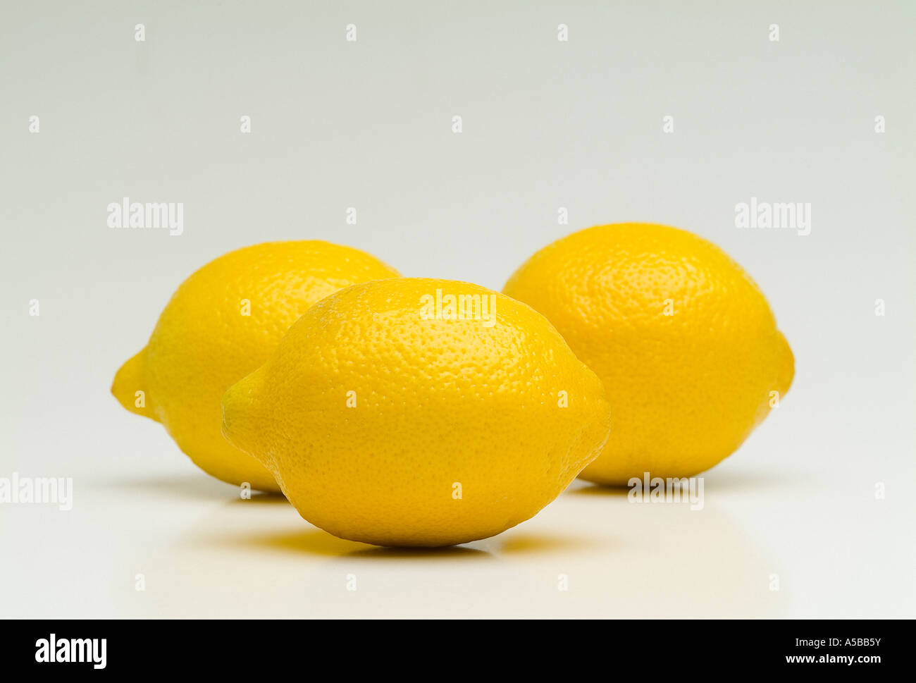 Three lemons on white Stock Photo - Alamy