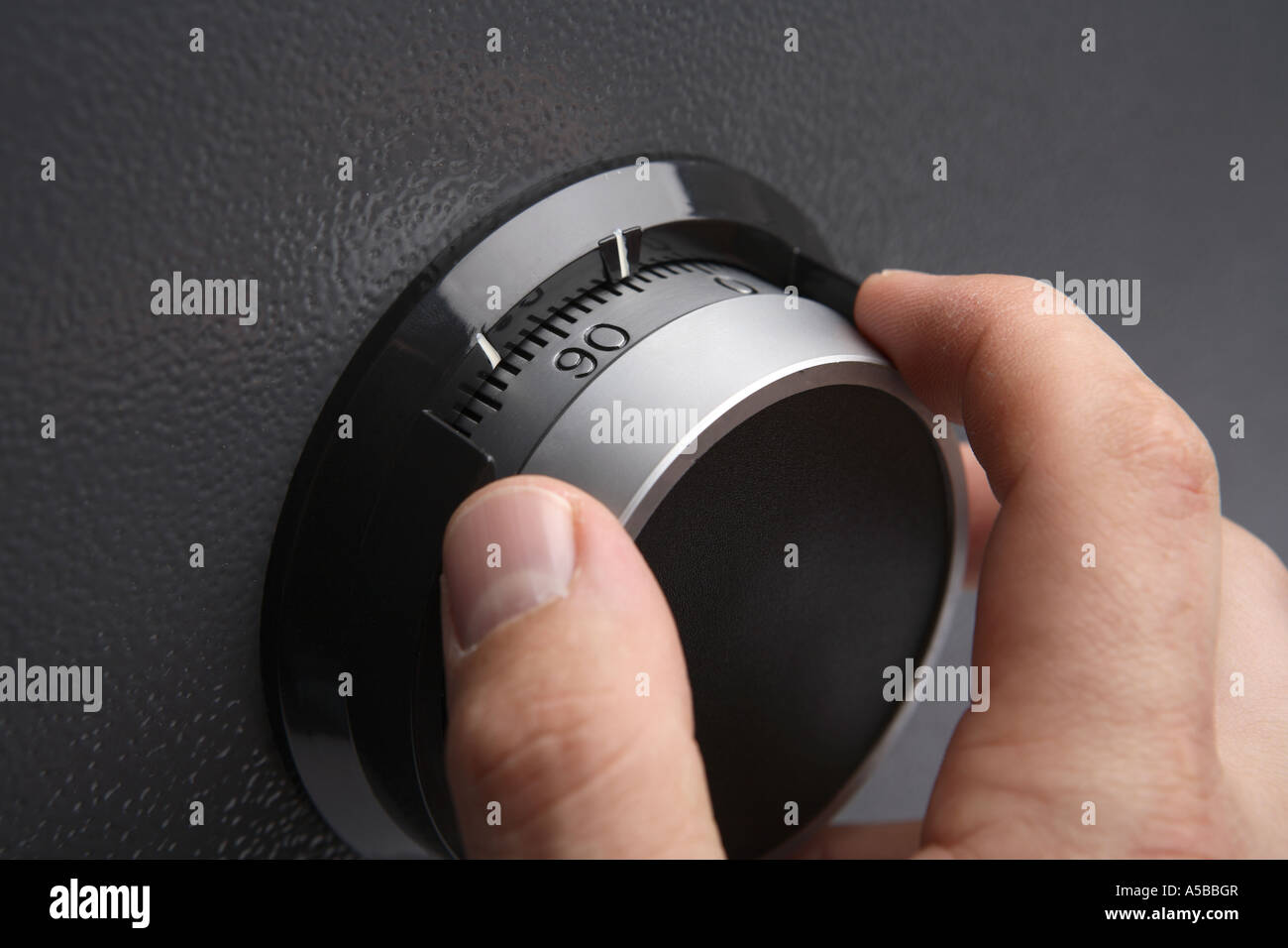 Hand on Safe Combination Dial Stock Photo - Alamy