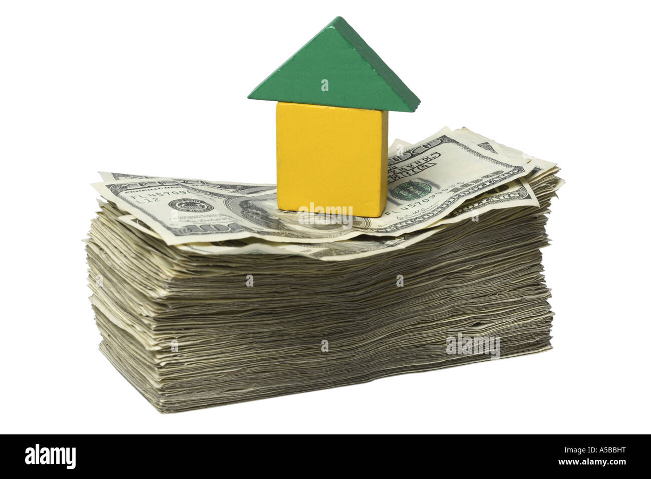 House made of Blocks on Stack of Money cut out on white background ...
