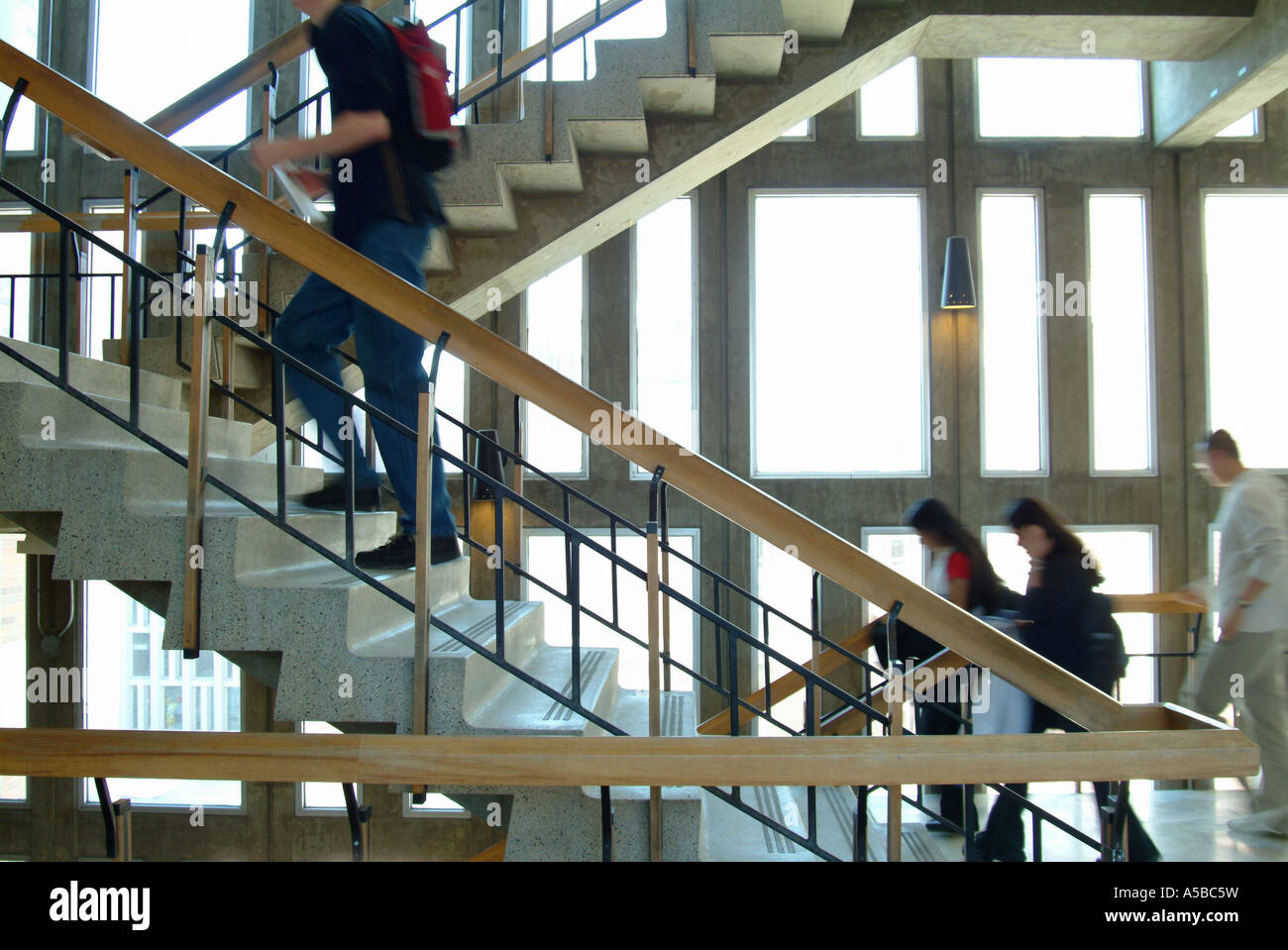 Students climbing up stairs Stock Photo - Alamy