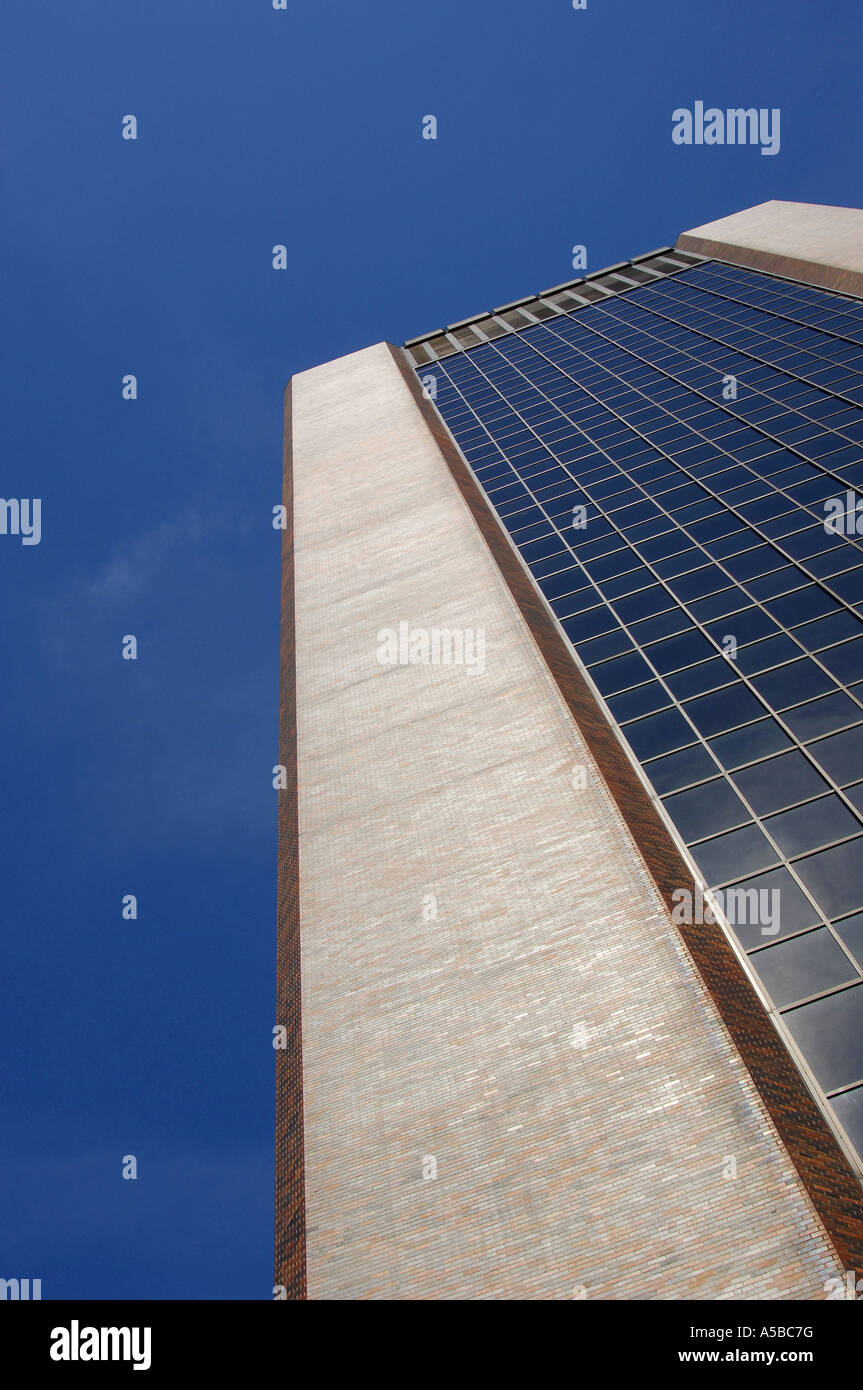Tall office building with blue sky background Stock Photo - Alamy