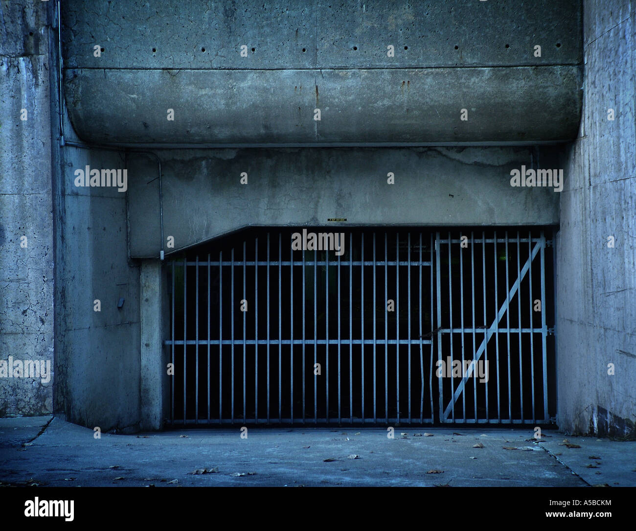 Ominous closed urban cement grating Stock Photo - Alamy