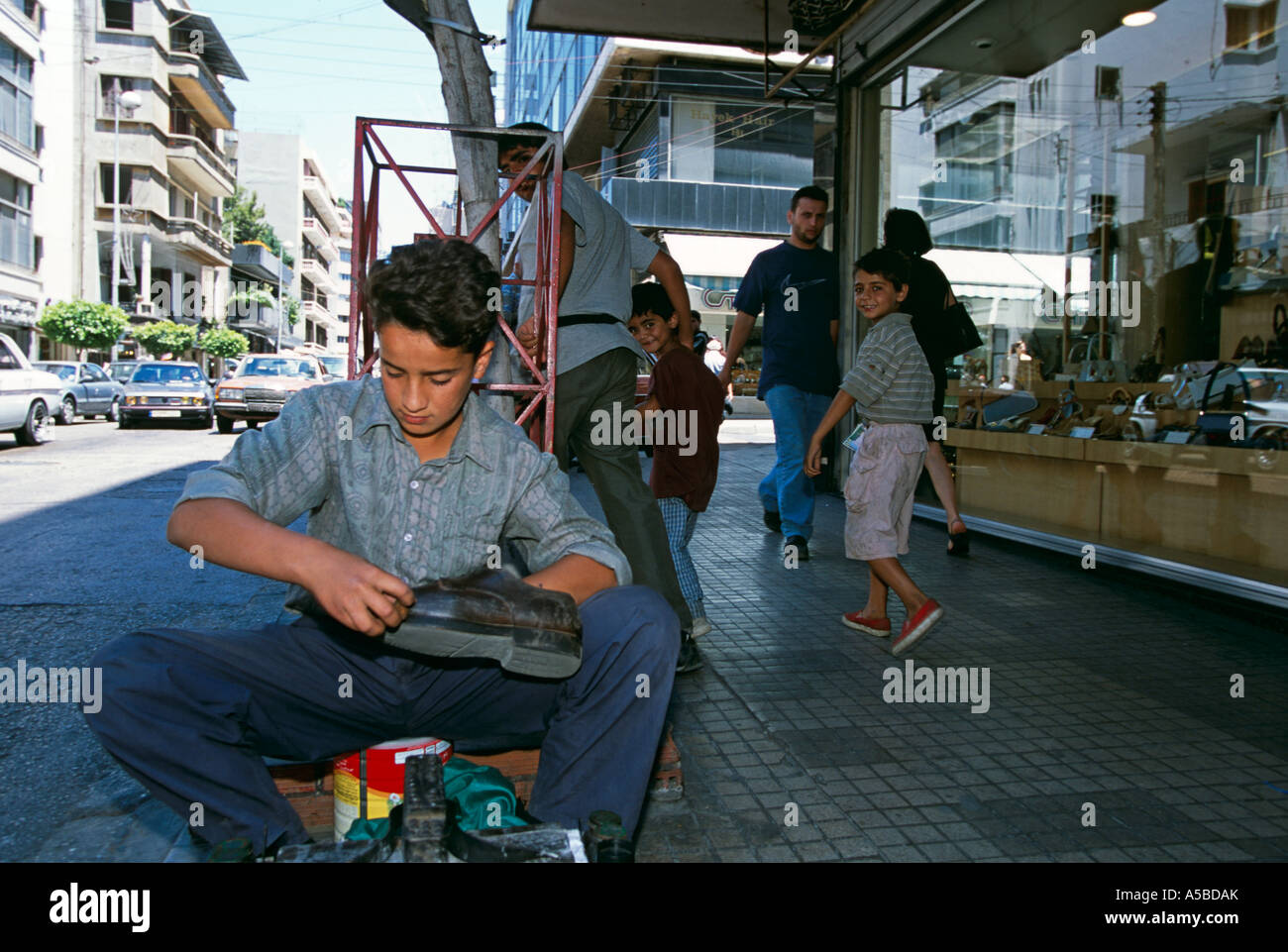 Shoeshine boy working, Hamra street, Beirut, Lebanon Stock Photo - Alamy