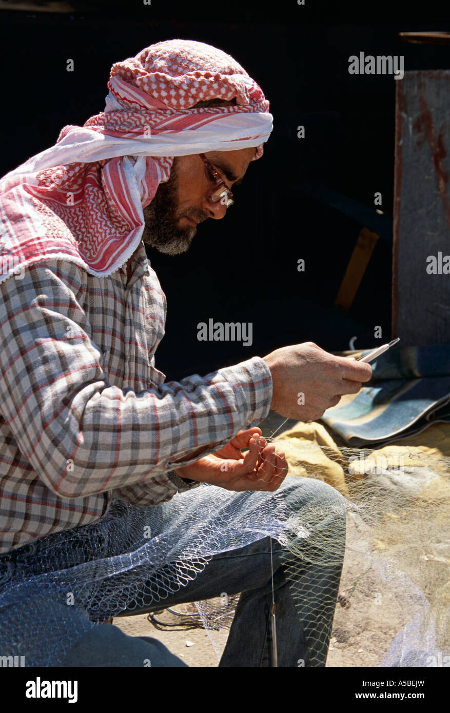 Fisherman repairing making hi-res stock photography and images - Alamy