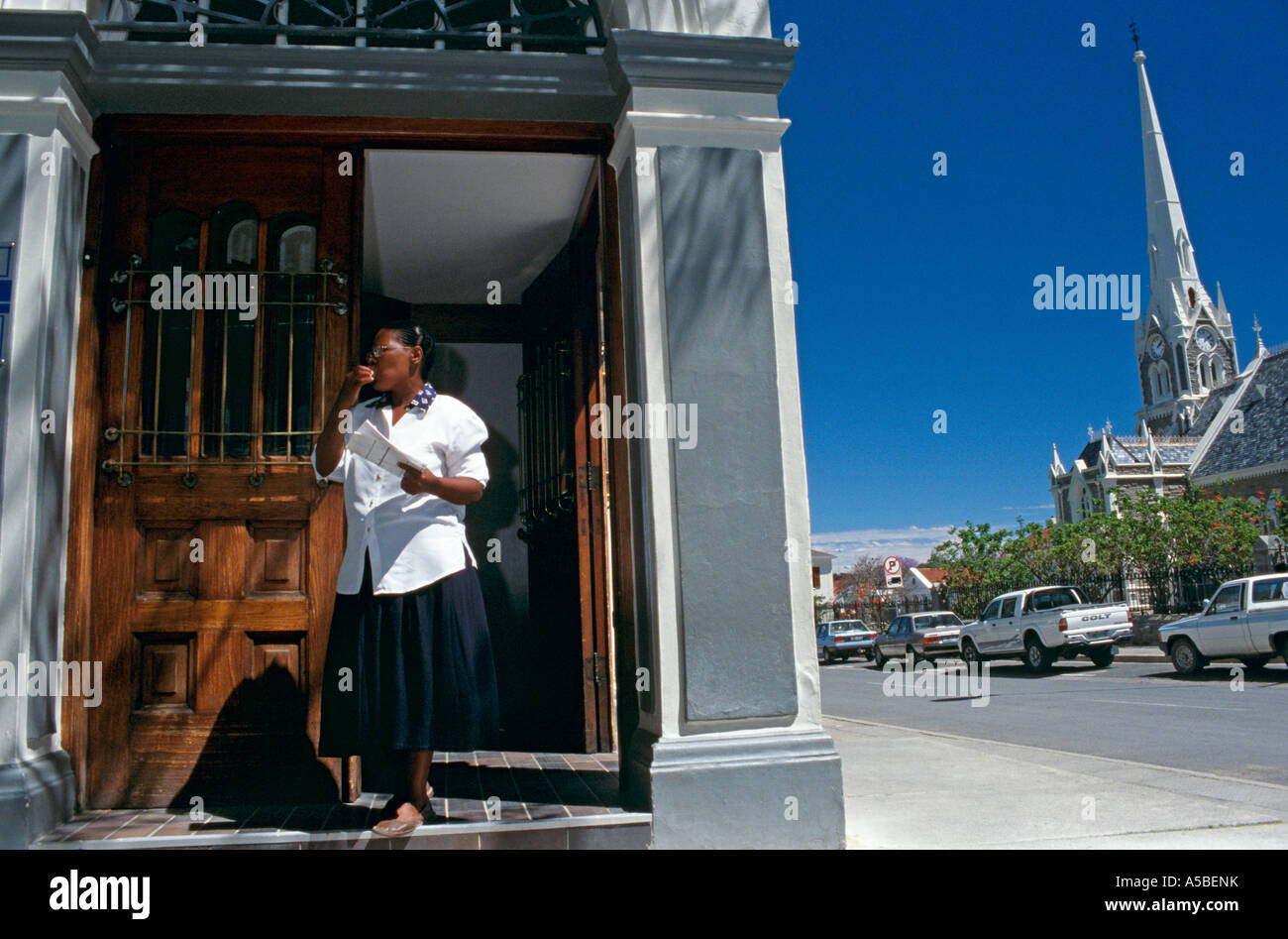 A woman standing at a doorstep in Graff Reinet South Africa Stock Photo ...