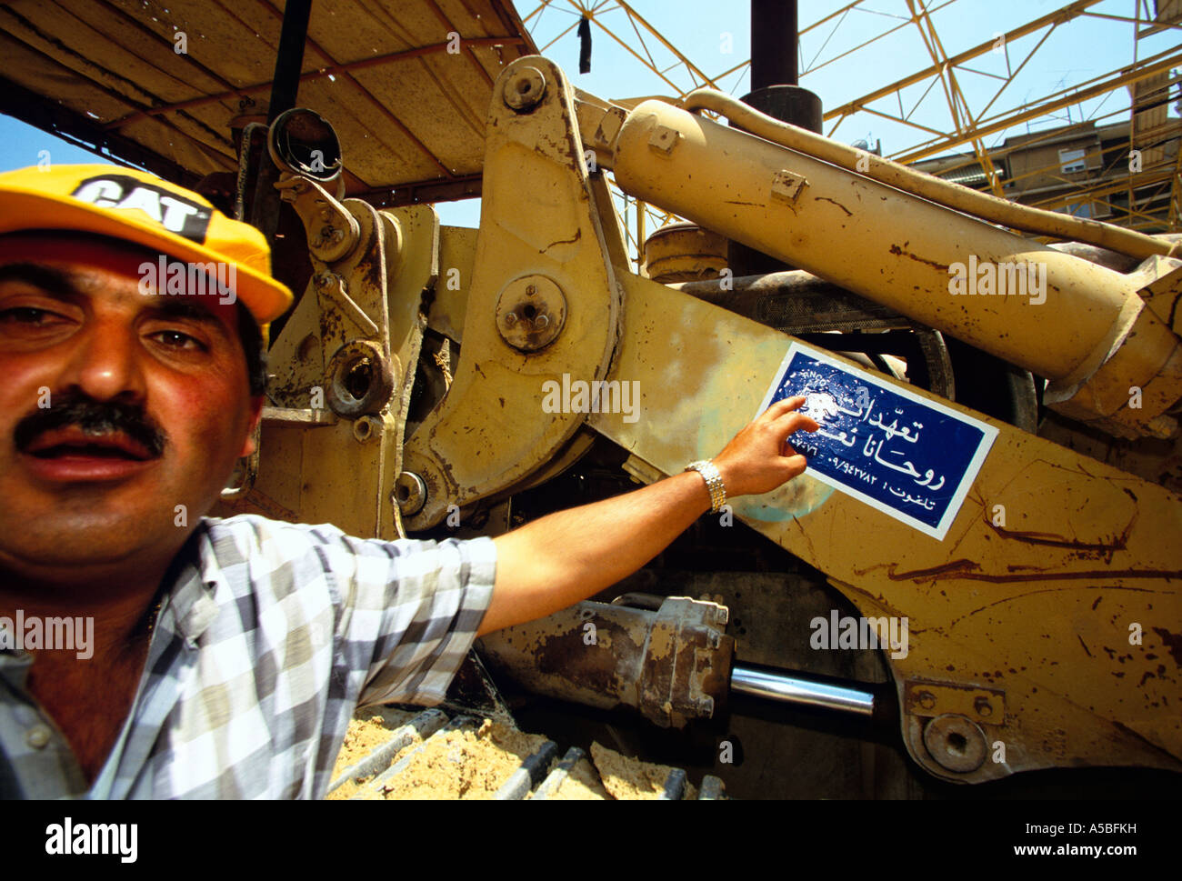 A man standing next to a vehicle at the Port of Beirut Stock Photo - Alamy