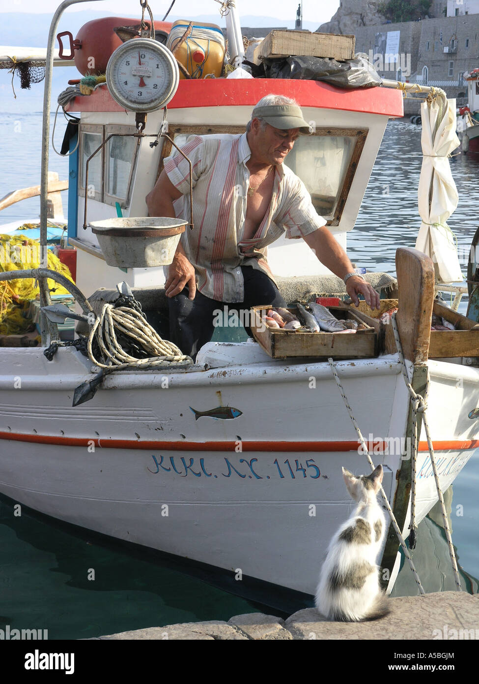 Greece island of Hydra port harbour fisherman selling his catch fresh ...