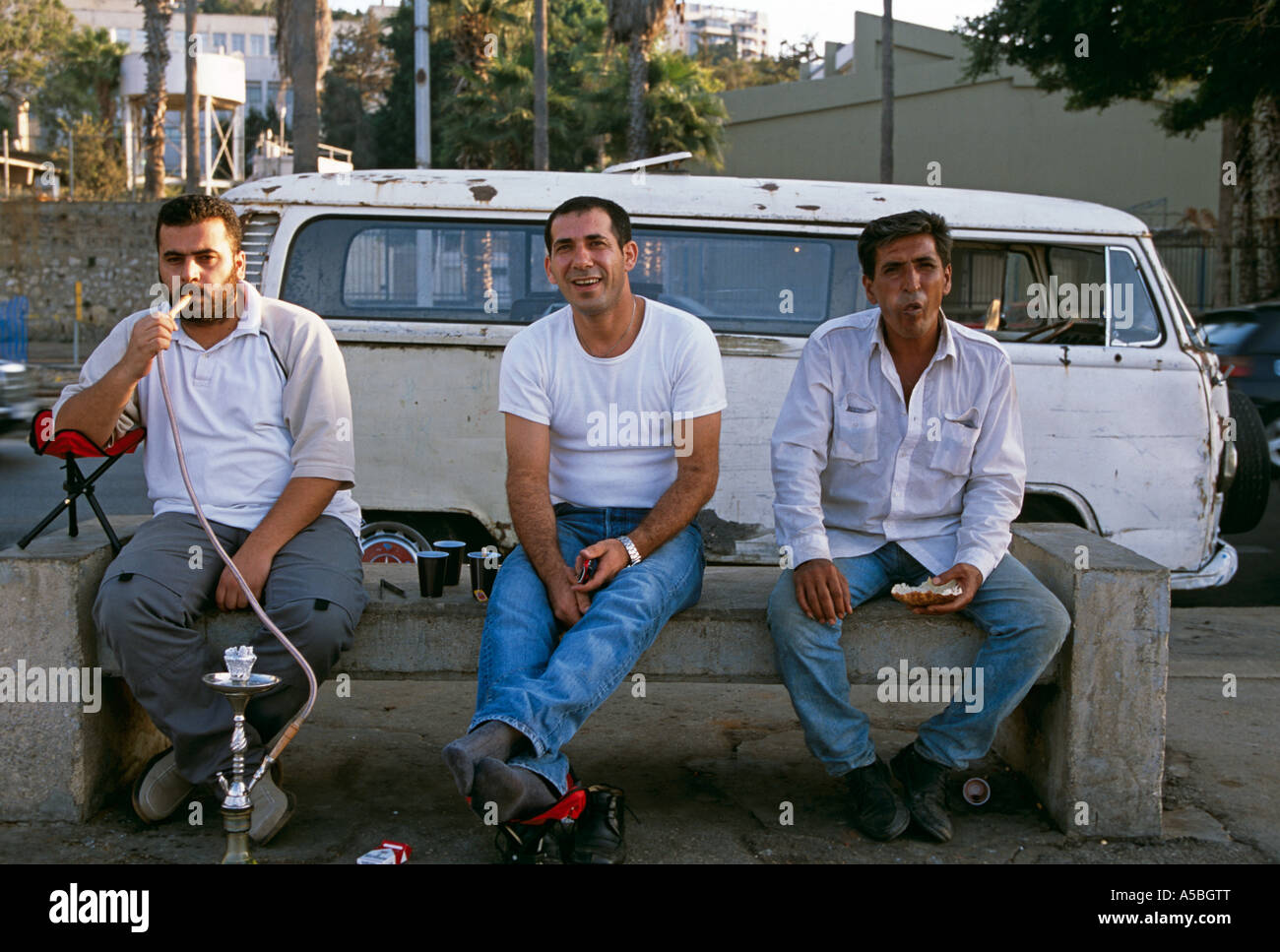 3 men on a bench hi-res stock photography and images - Alamy