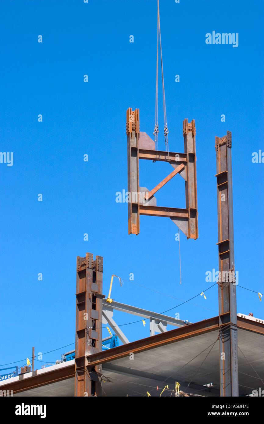 Metal section for a building being hauled into place at a construction ...