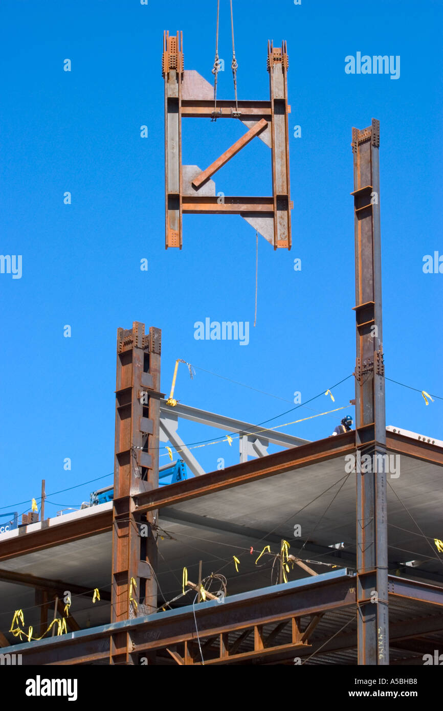 Metal section for a building being hauled into place at a construction ...