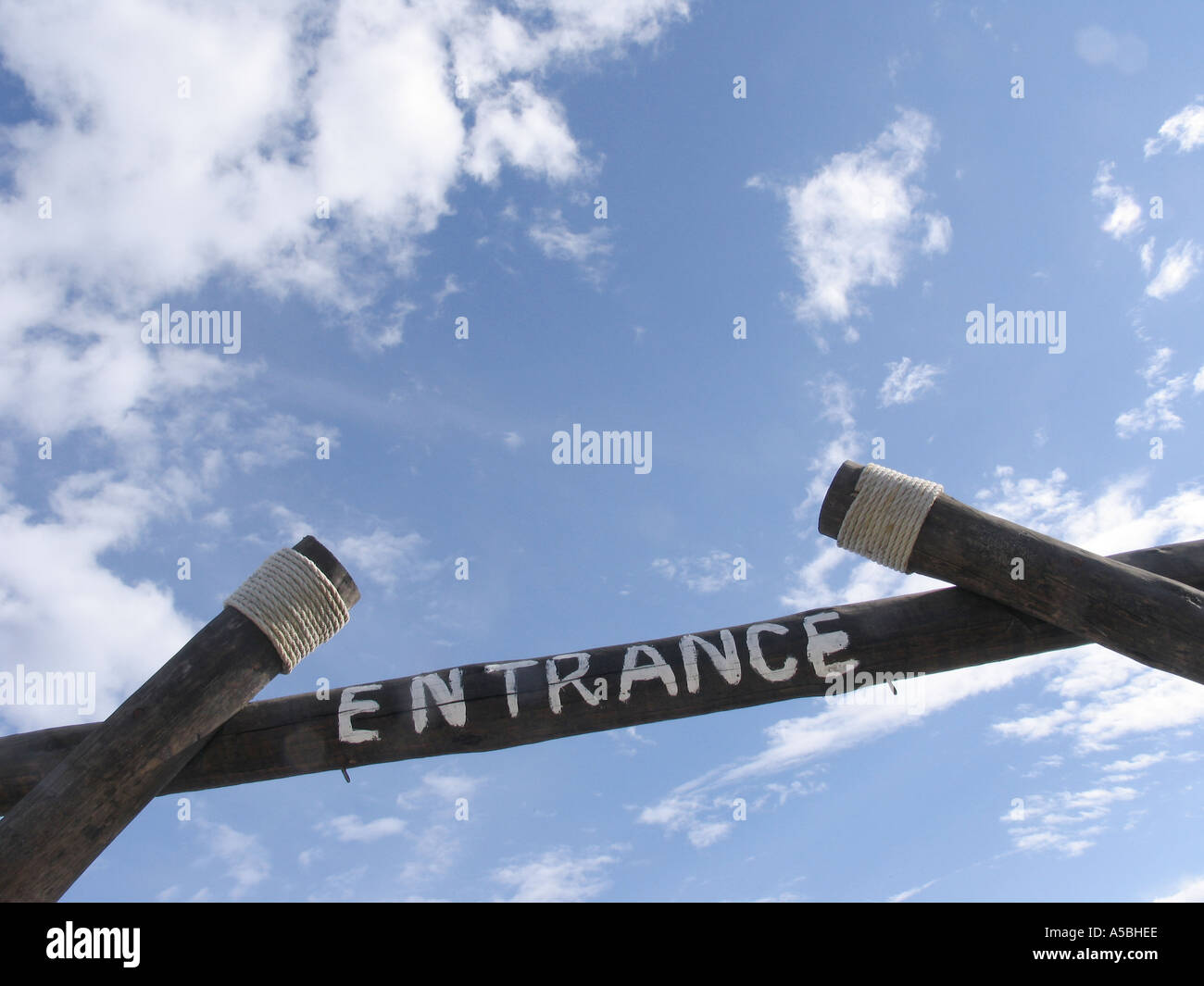 Sign saying Entrance sky and clouds above Stock Photo - Alamy
