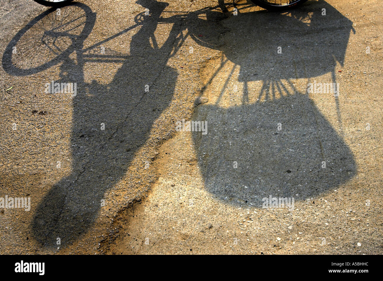 Shadow on road of driver and bicycle rickshaw Kanchanaburi Thailand ...