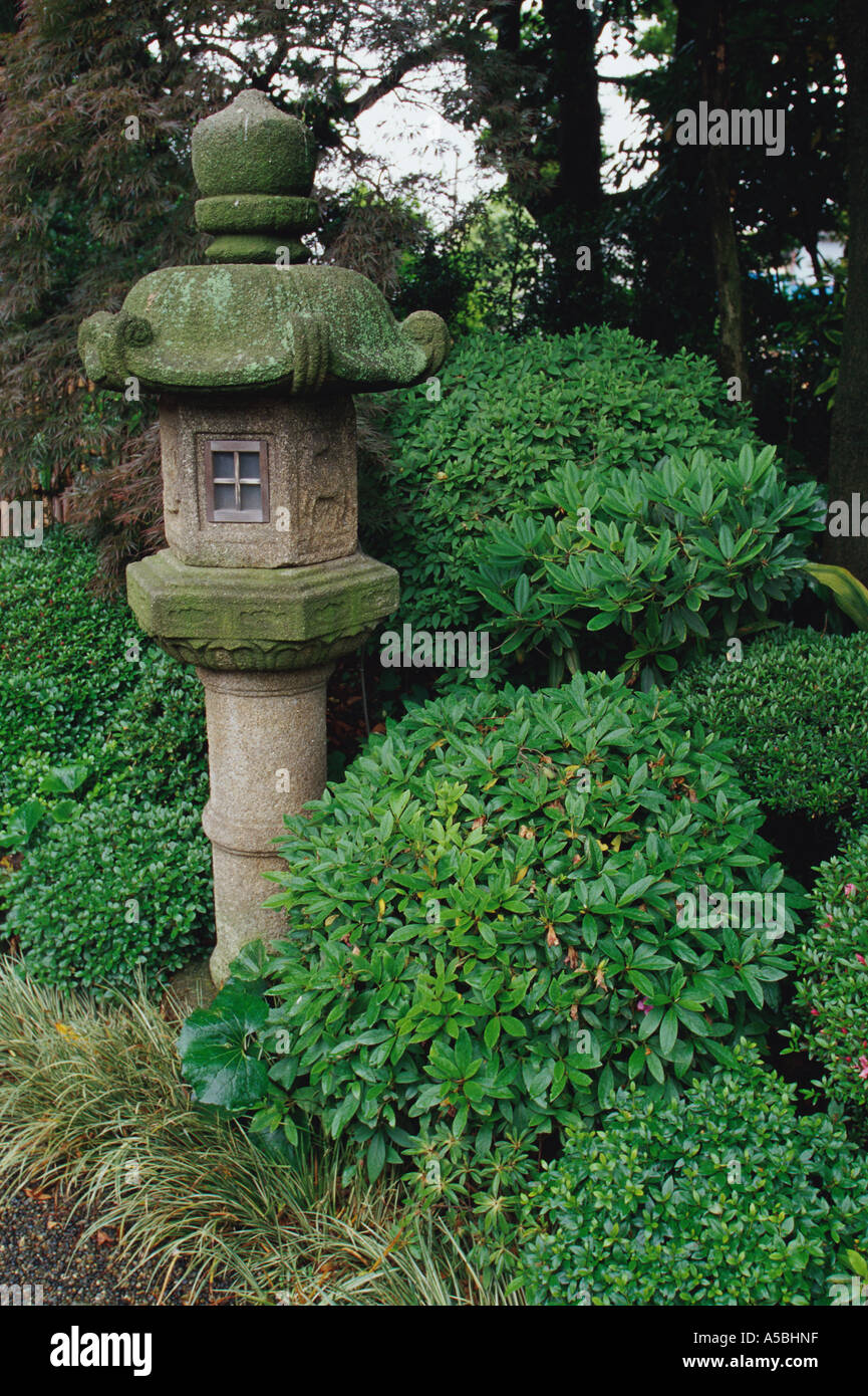 Stone lantern in a garden Stock Photo - Alamy