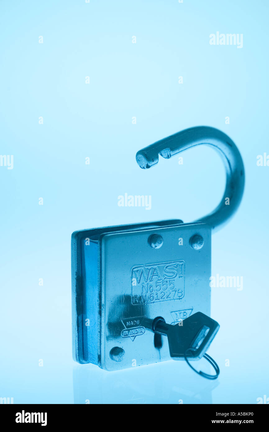 Open lock with key in keyhole Stock Photo - Alamy