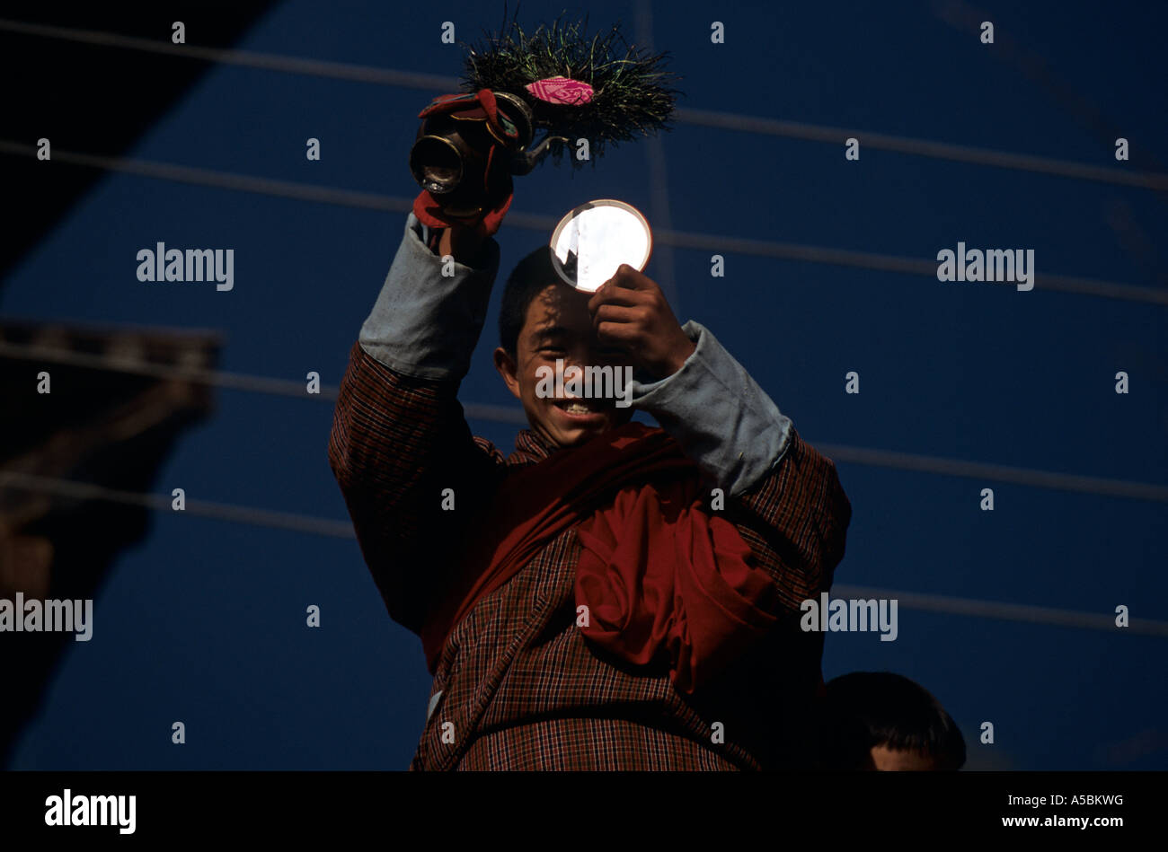 A Bhutanese man performing a ritual Stock Photo - Alamy