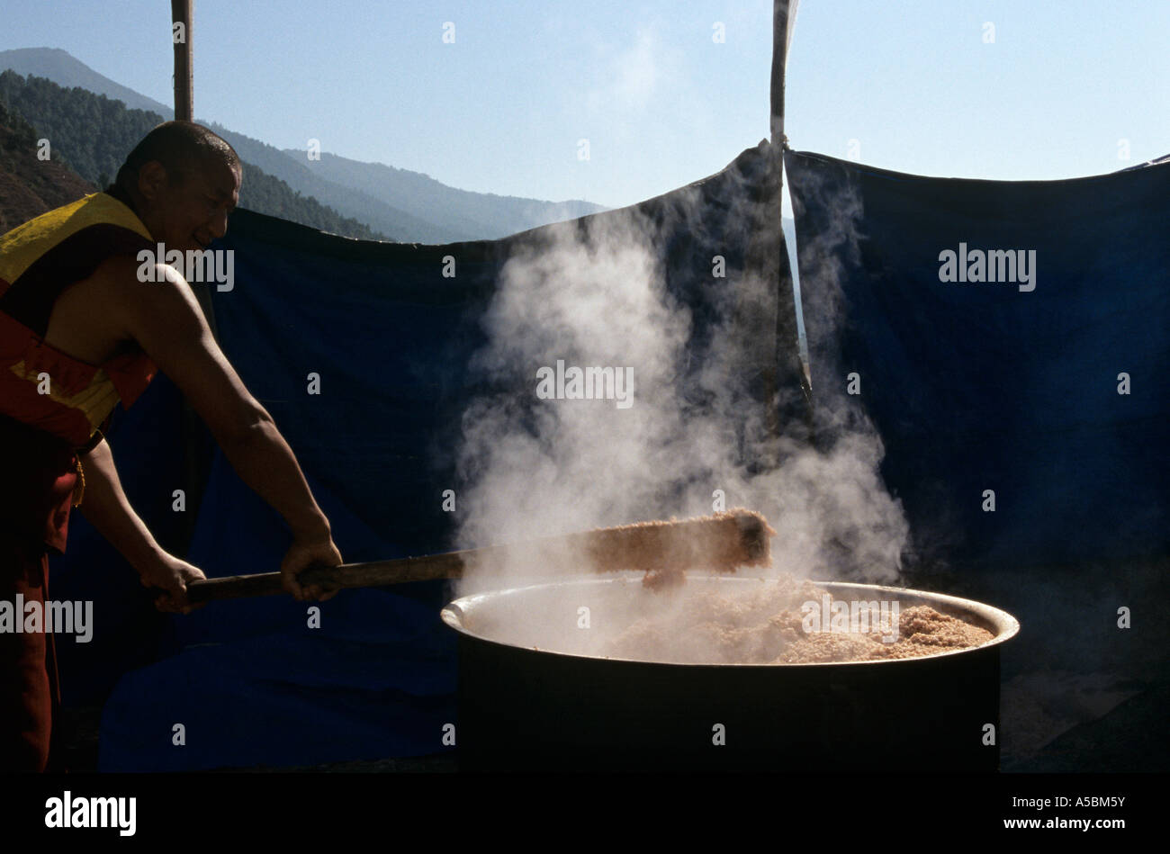 A Bhuddist Monk cooking in Bhutan Stock Photo - Alamy