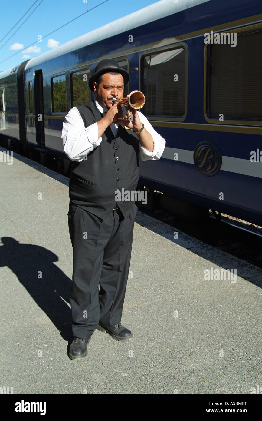 The Blue Train. Bugle playing porter greets the famous train at ...